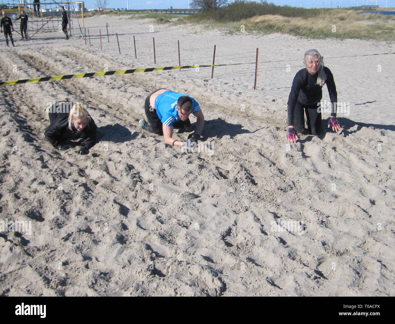 Active people during extreme obstacle course in boot camp Stock Photo ...