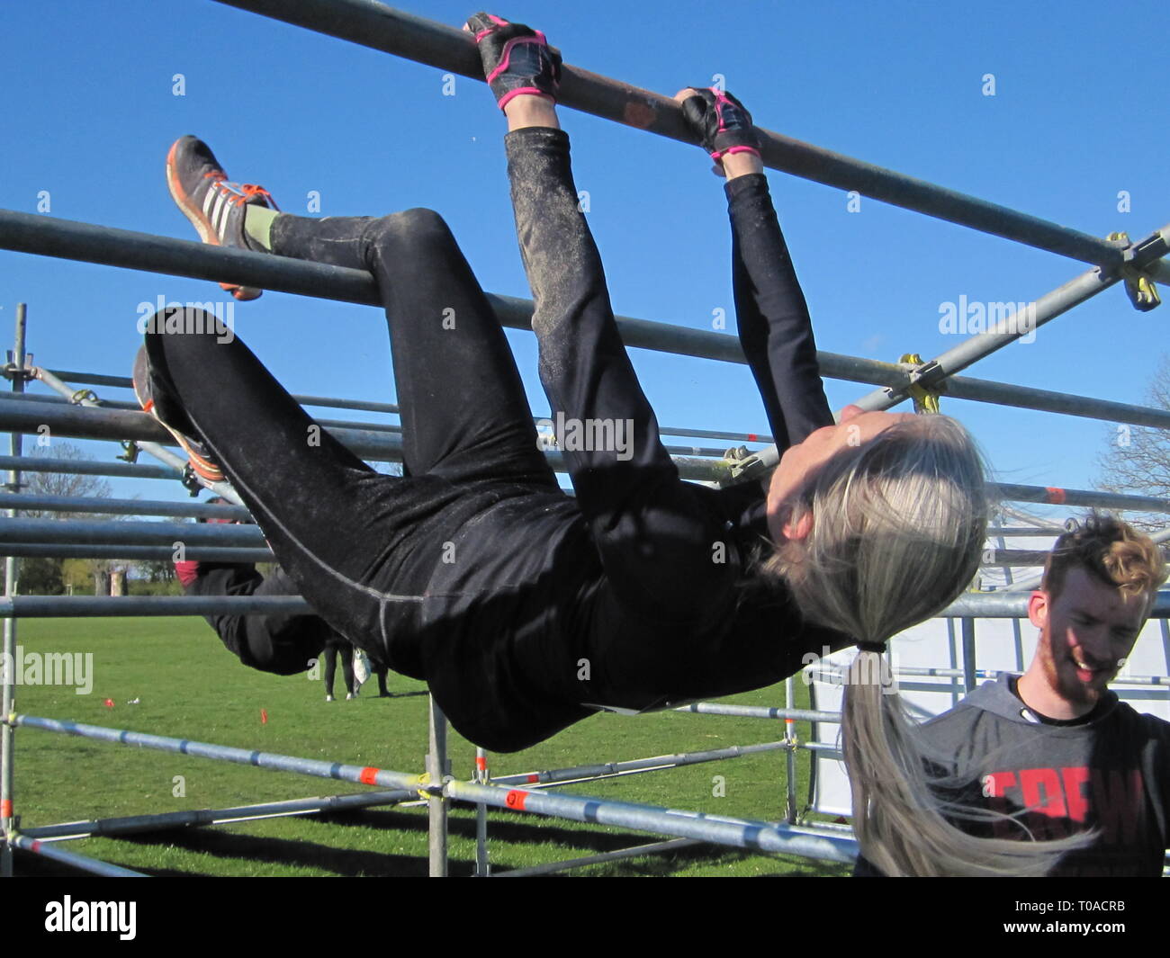 Active people during extreme obstacle course in boot camp Stock Photo ...