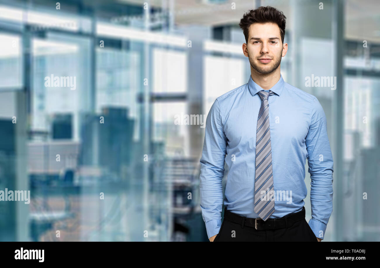 Young manager in his office Stock Photo - Alamy