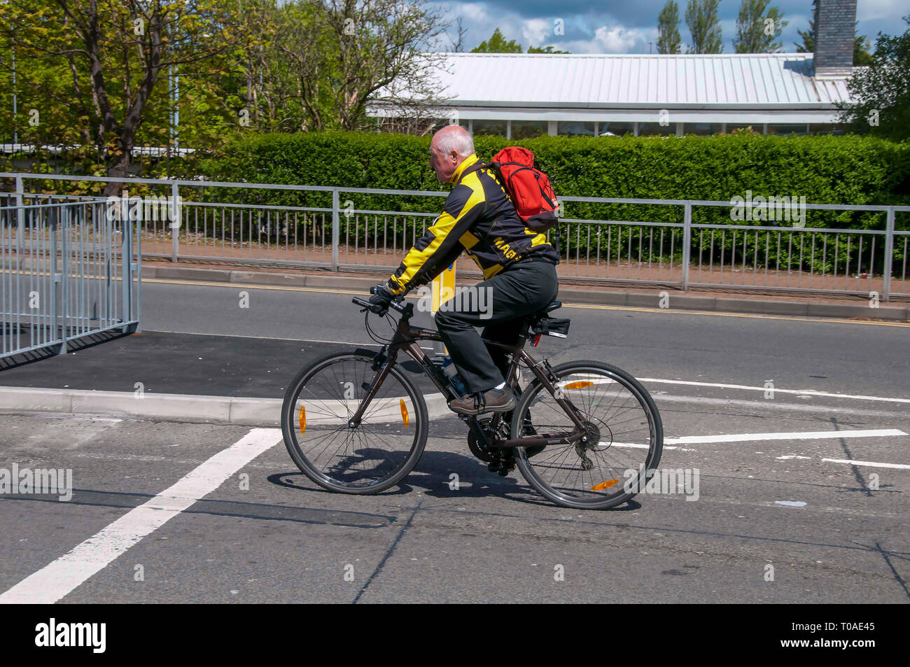 Cyclist on main road hi-res stock photography and images - Alamy