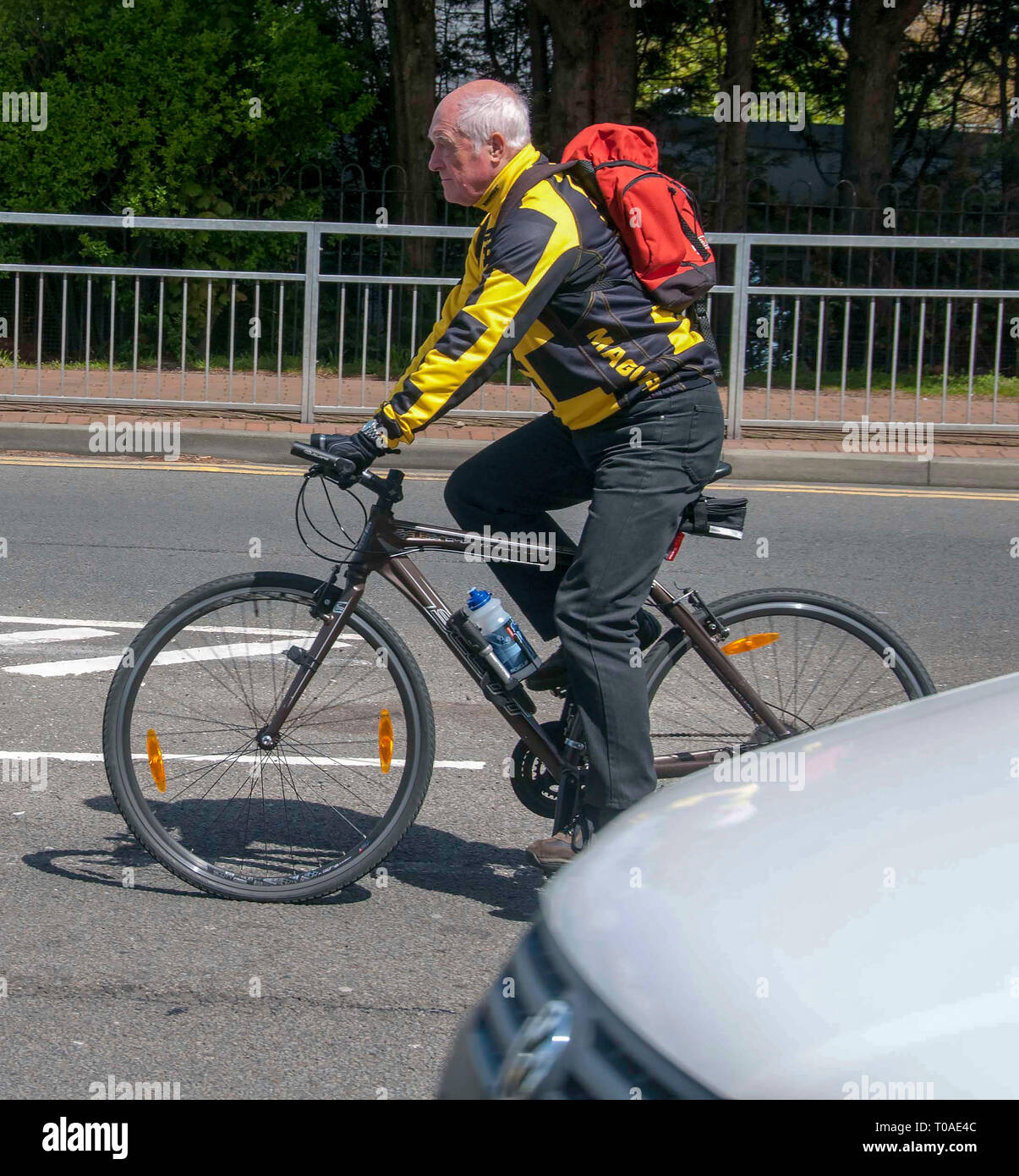 Cyclist on main road hi-res stock photography and images - Alamy