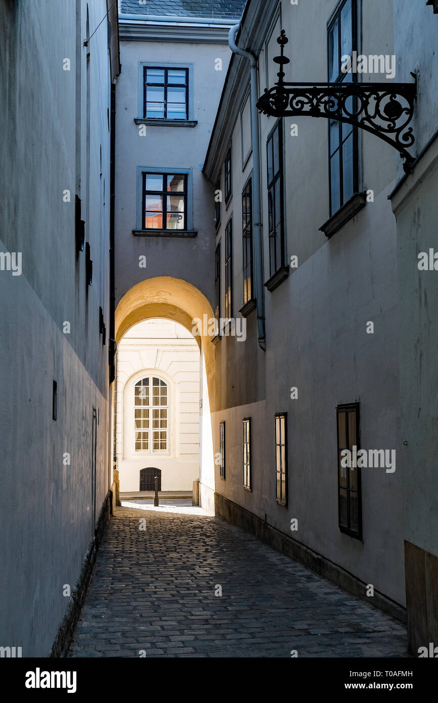 A covered passageway with arches Stock Photo - Alamy