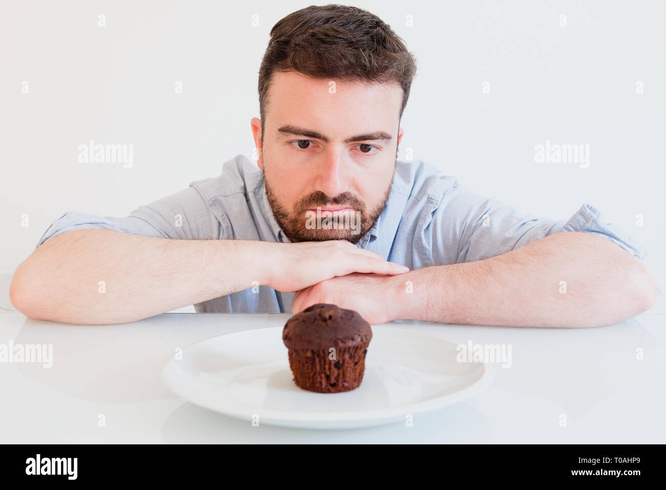 Man eating chocolate hi-res stock photography and images - Alamy