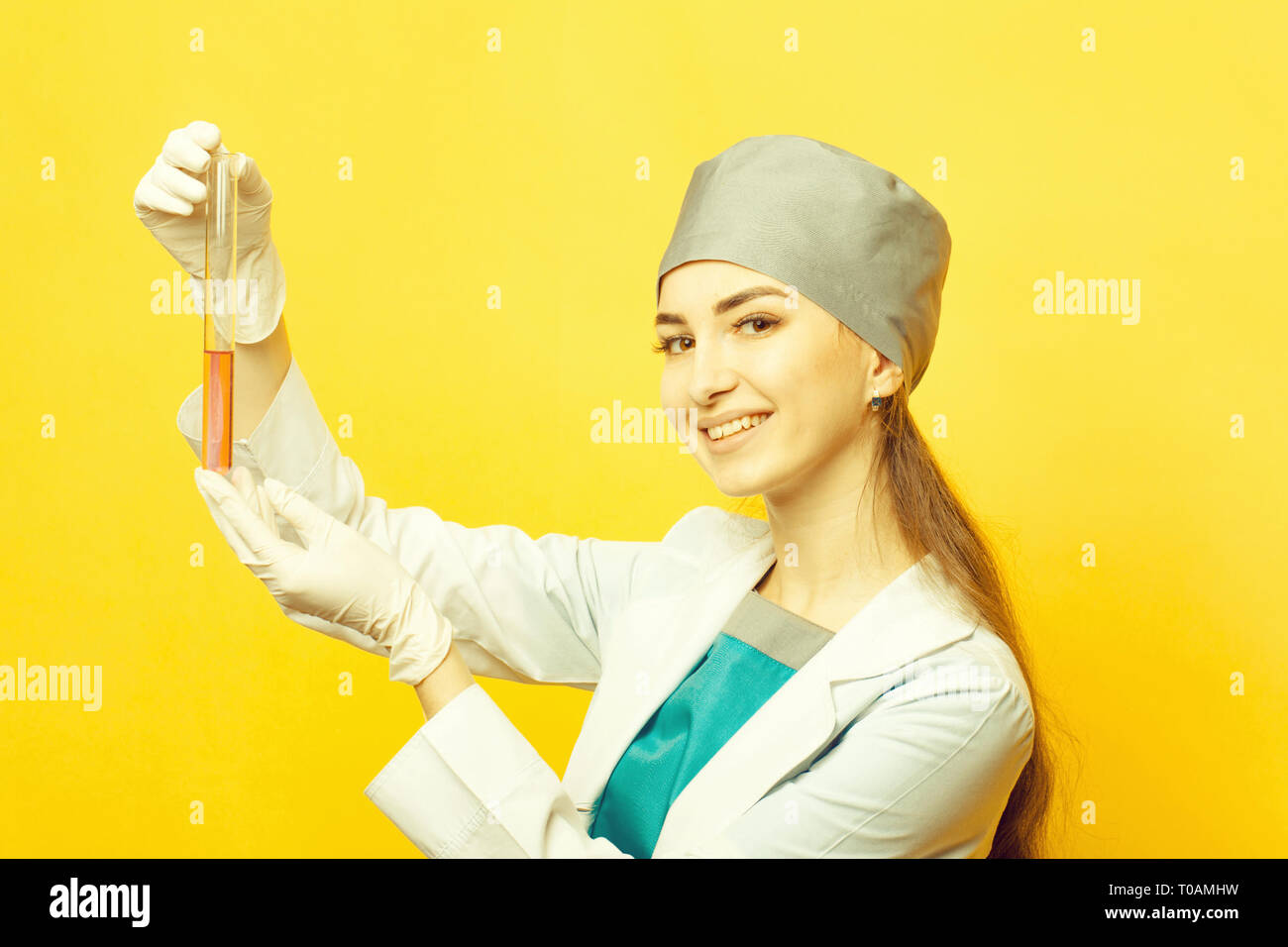 Female scientist with flask Stock Photo - Alamy