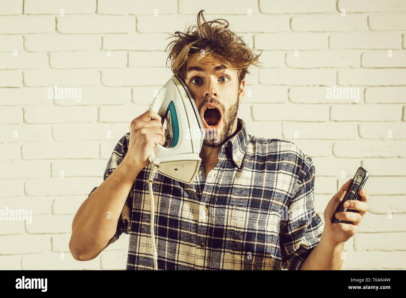 Iron man with cell phone hi-res stock photography and images - Alamy