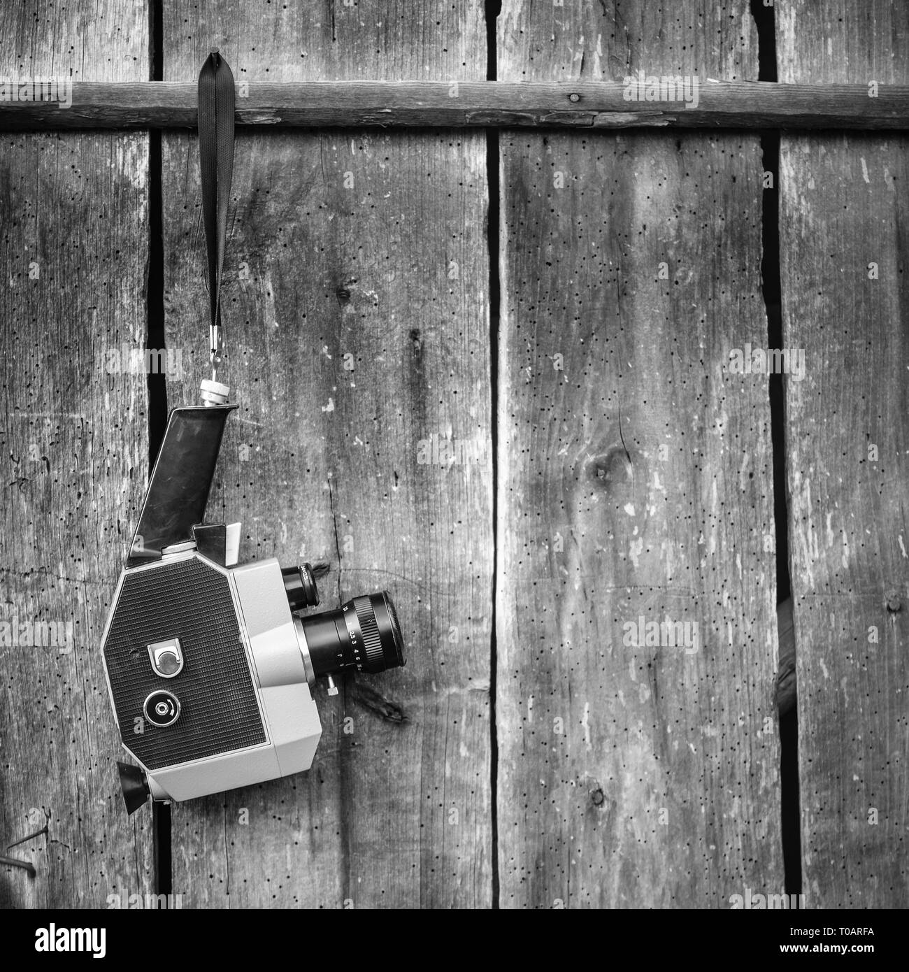 Vintage film camera on wooden wall. Concept - movie of the 1970s-1980s ...