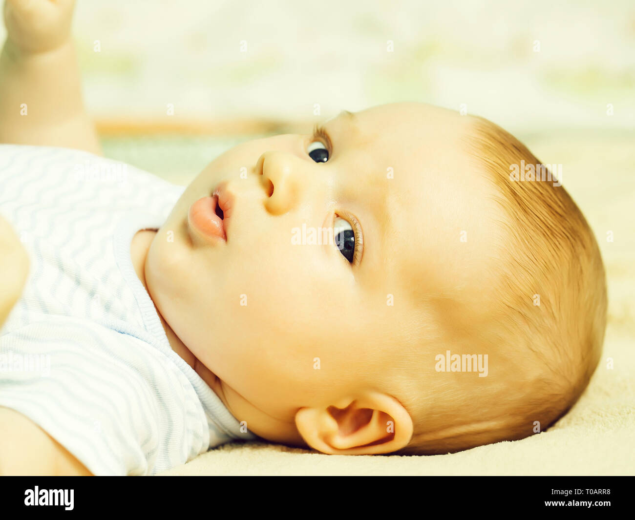 Cute baby boy awake Stock Photo - Alamy