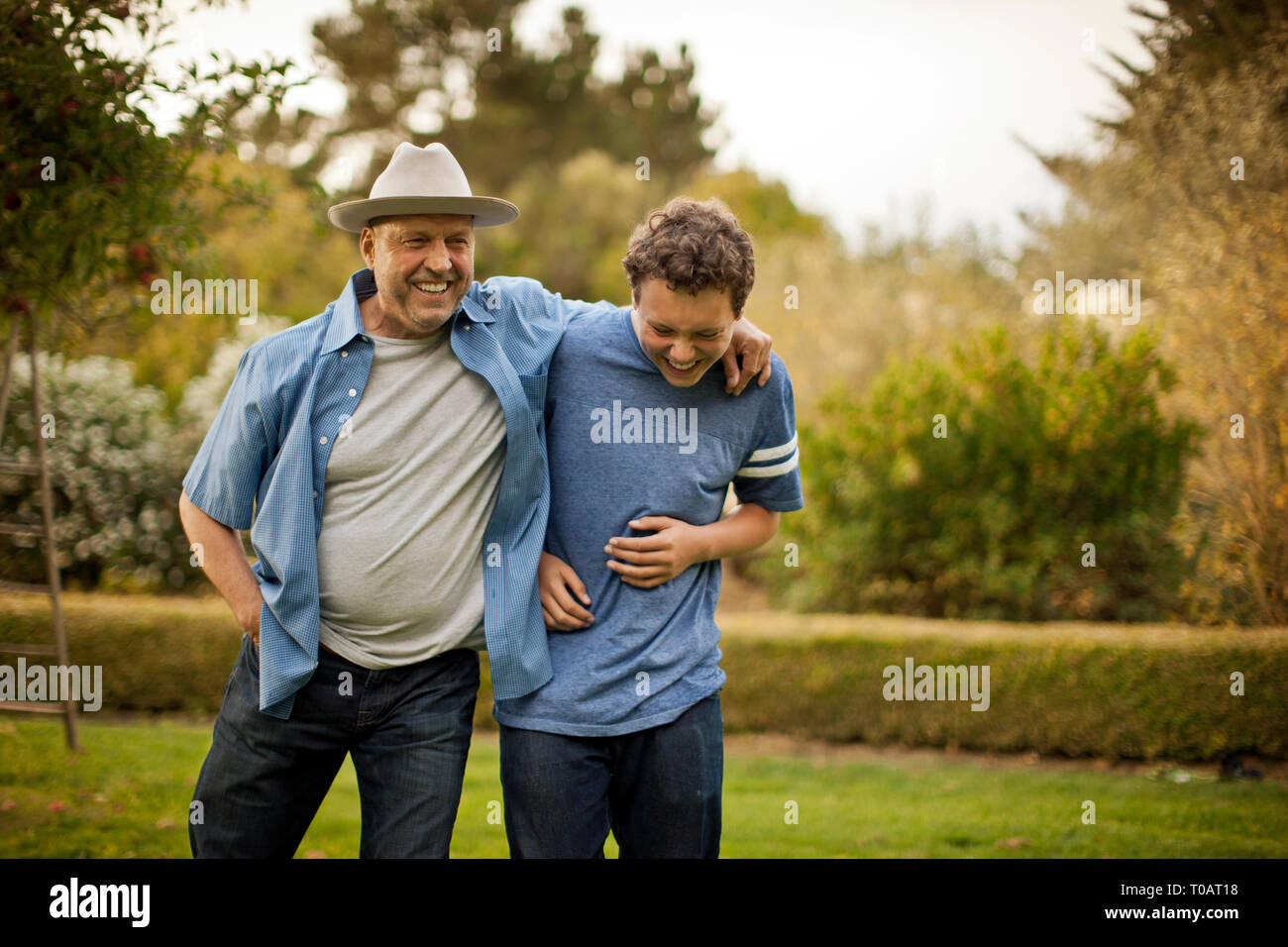 Portrait of a smiling father and teenage son Stock Photo - Alamy