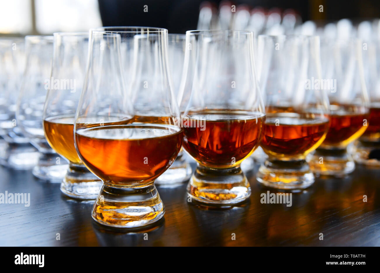 Whisky or cognac in snifters, soft focus, amber-blue toned Stock Photo ...