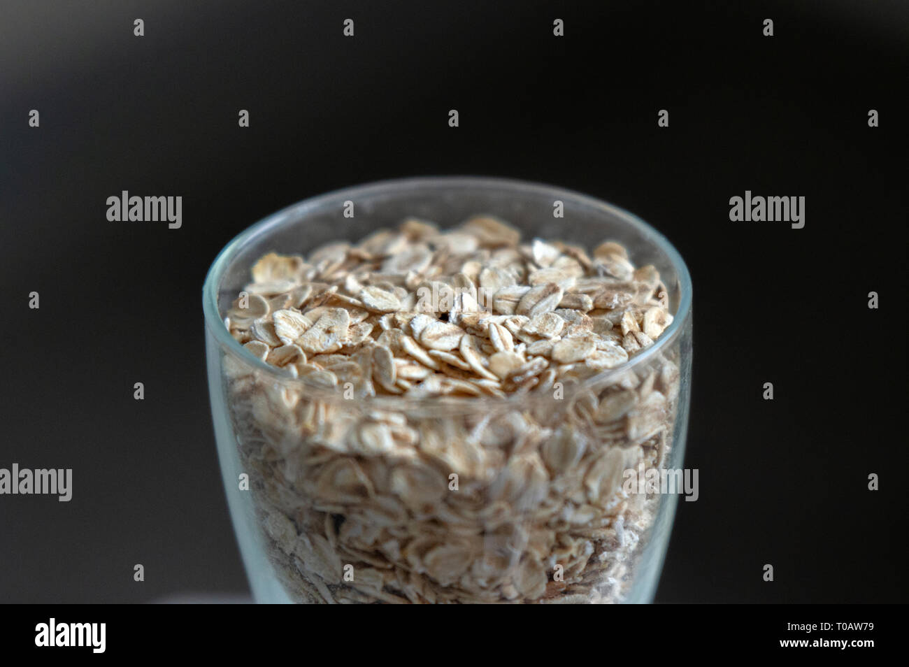 Raw oats in a glass hi-res stock photography and images - Alamy