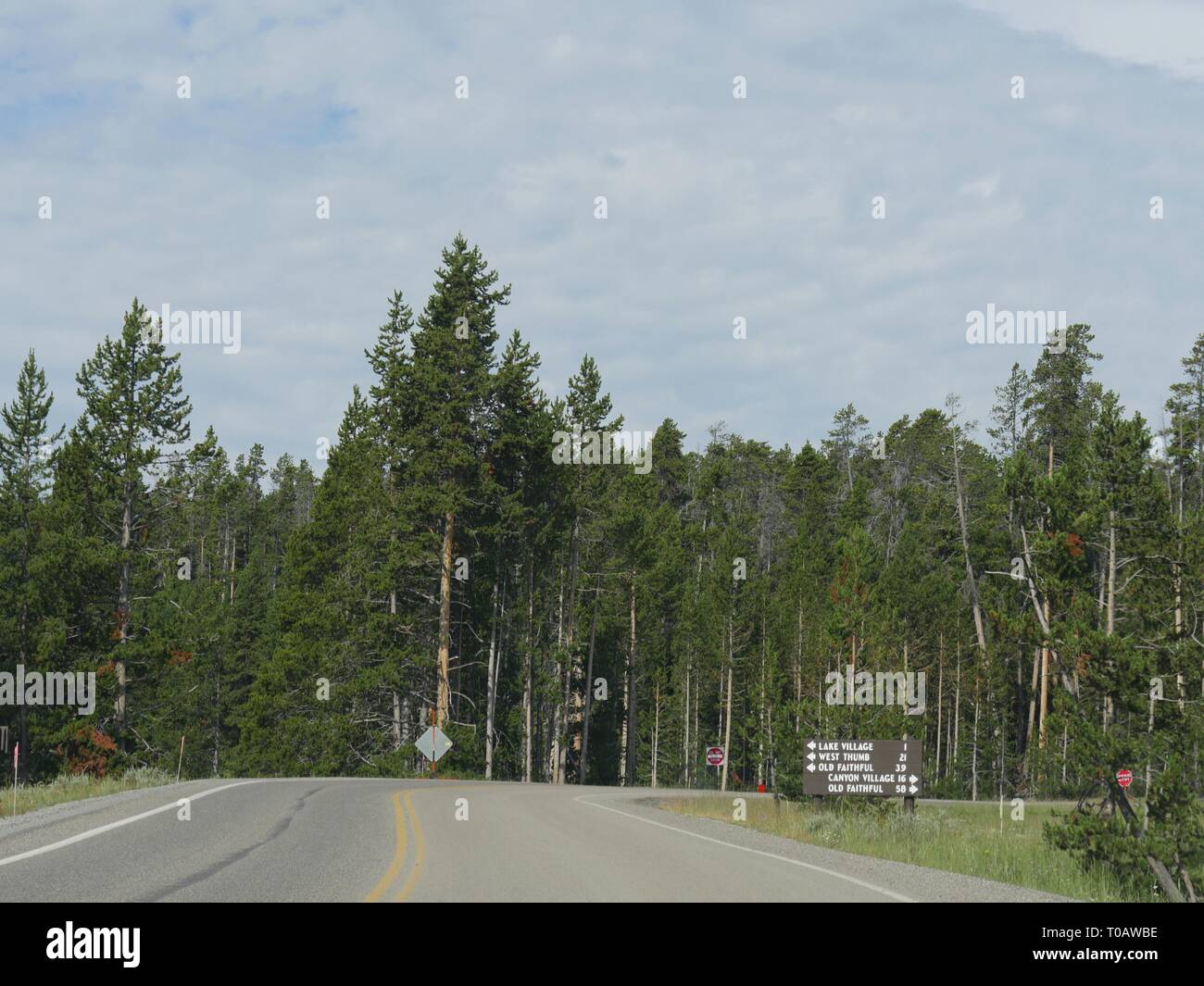 Paved road intersections with directions to different destinations at ...