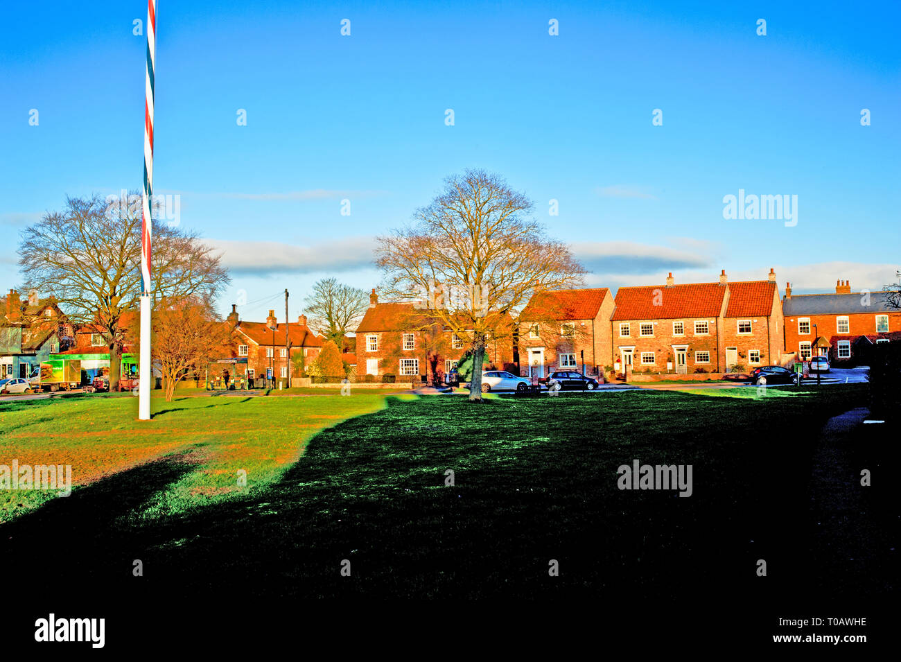 Maypole village green and new build cottages, Upper Poppleton, North ...