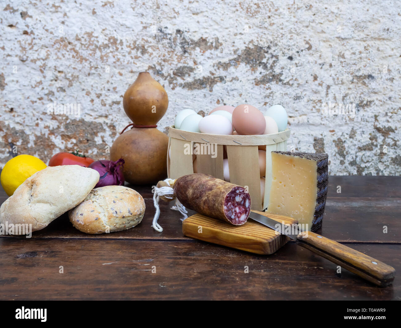 Traditional spanish food on an old wooden table, Iberian pork sausages ...