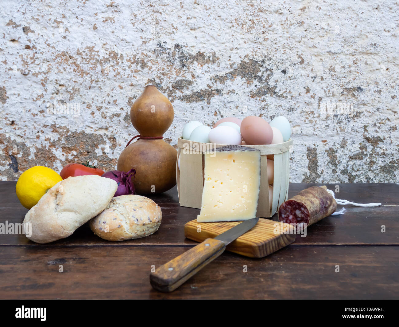 Traditional spanish food on an old wooden table, Iberian pork sausages ...