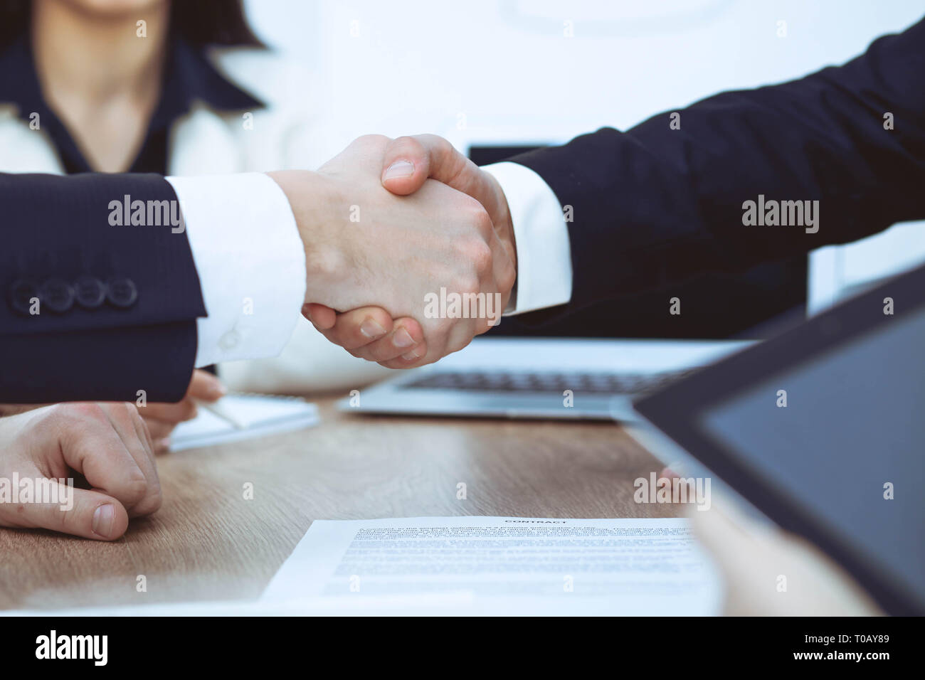 Business people shaking hands at meeting or negotiation in the office ...