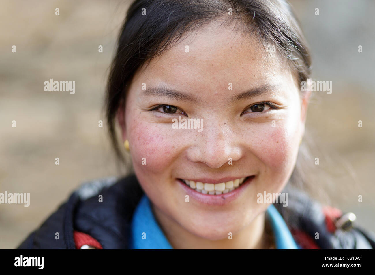 Portrait of smiling young tibetan woman, Sichuan, China Stock Photo - Alamy