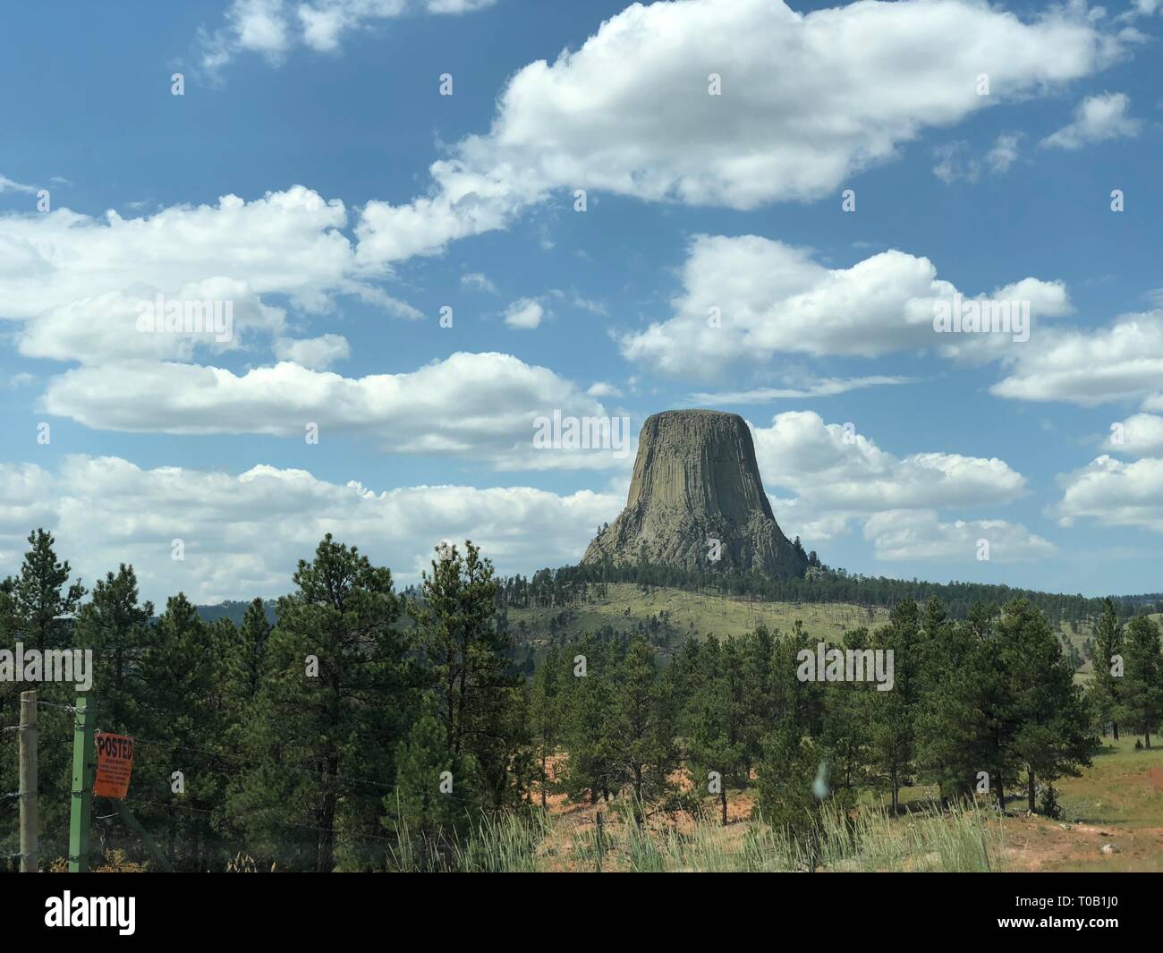Distant view of Devils Tower in Wyoming, with gorgeous clouds in the ...