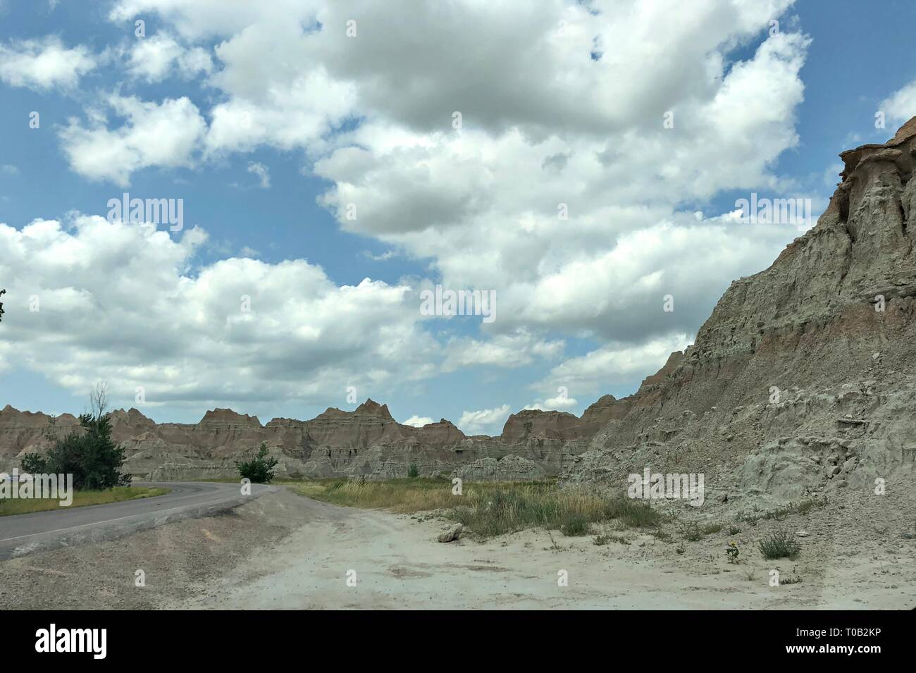 Wide shot of layered landscapes and rock formations at the Badlands ...