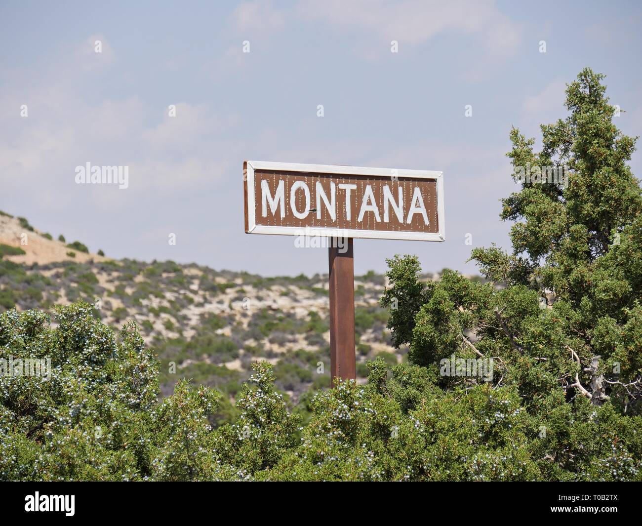 Montana sign by the roadside at the Montana-Wyoming boundary at Bighorn ...