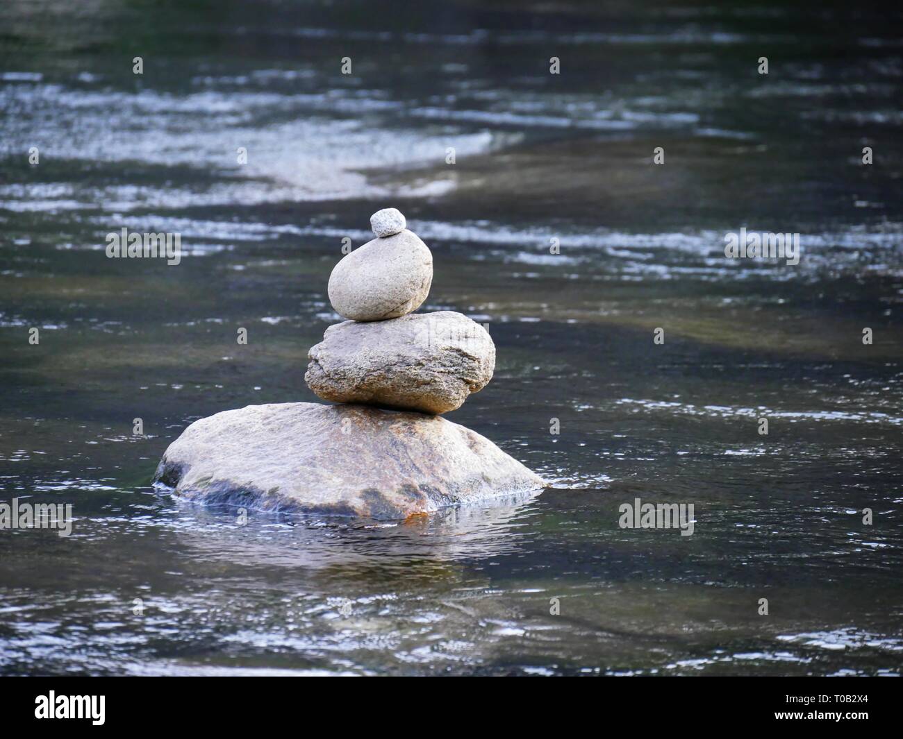 Four stacked stones hi-res stock photography and images - Alamy