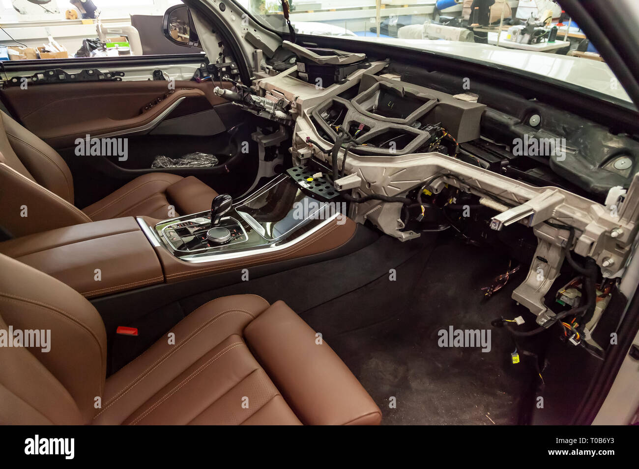 The interior of a modern business class car with brown leather seats ...