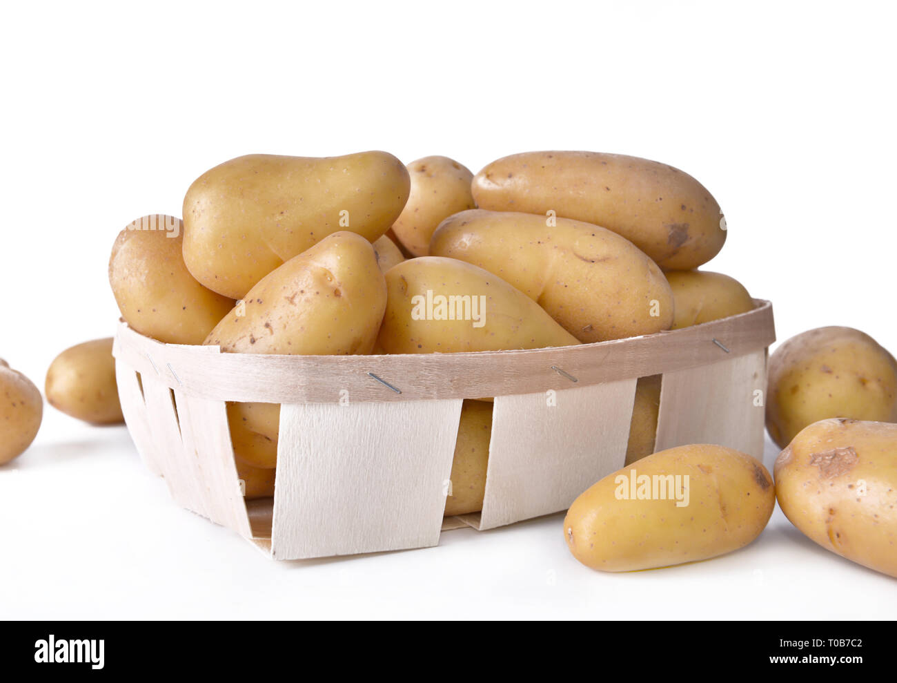 tray full of fresh potatoes on white background Stock Photo - Alamy
