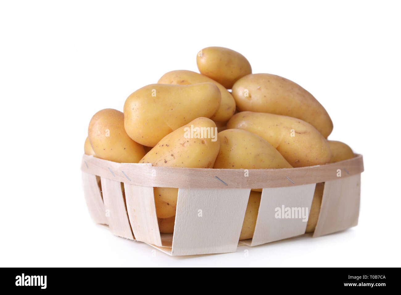 tray full of raw potatoes isolated on white background Stock Photo - Alamy