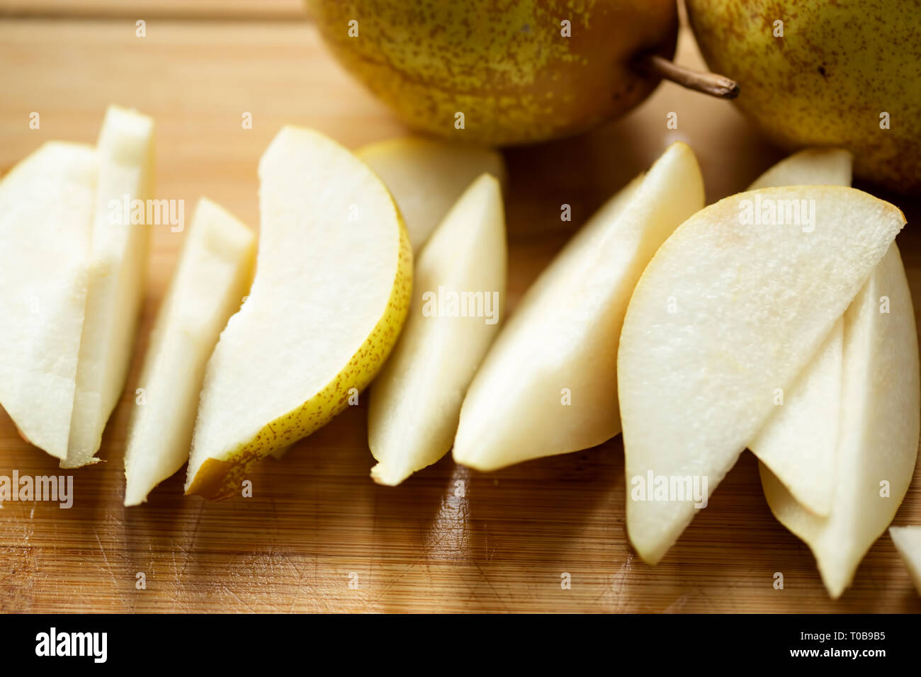 Cutting slicing pears Stock Photo - Alamy