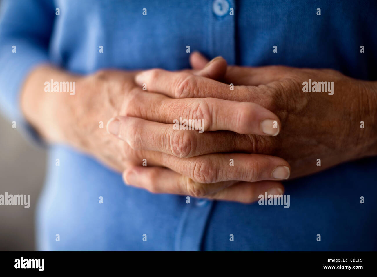 Hands clasped together hi-res stock photography and images - Alamy