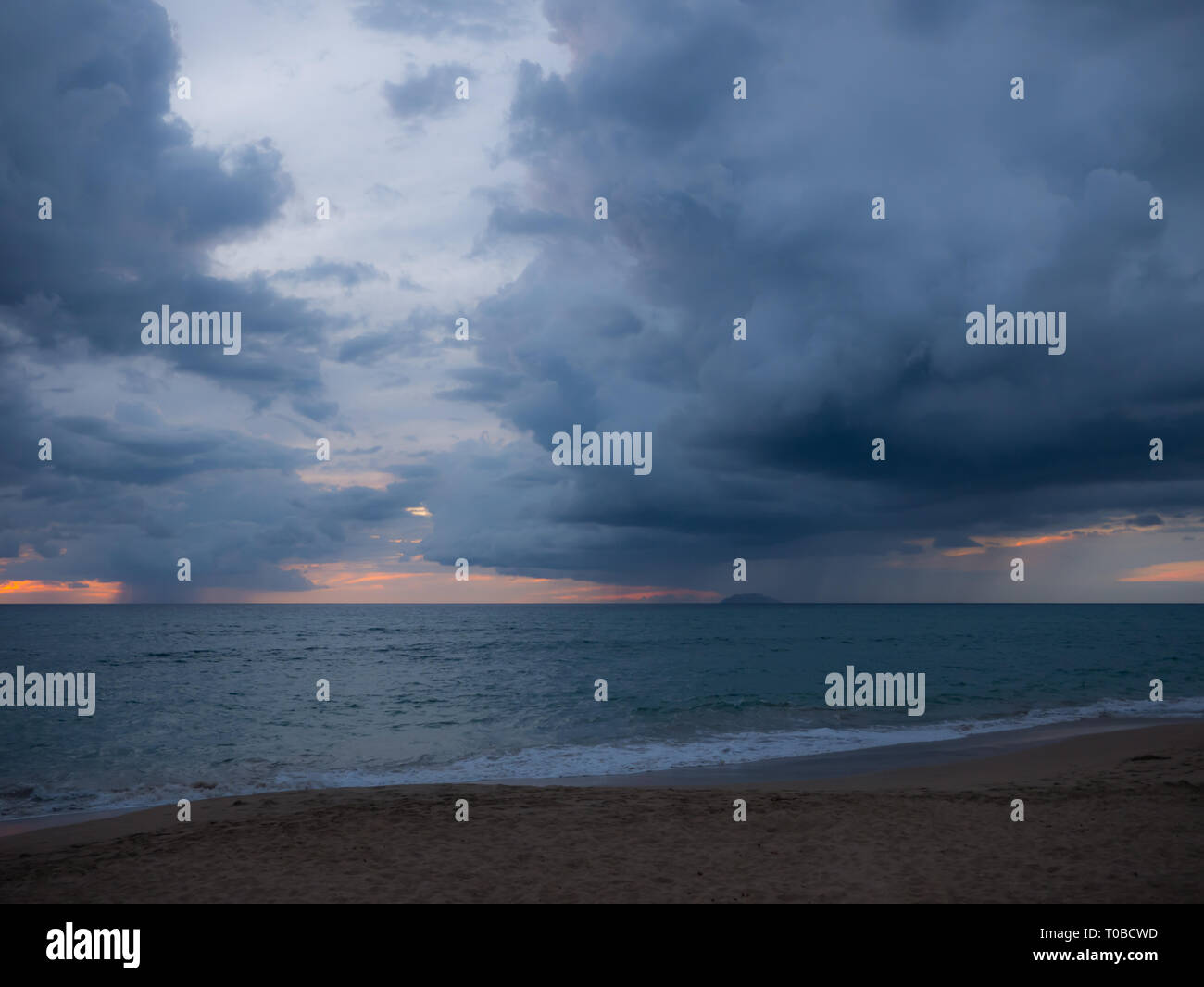 The Caribbean sun setting over the beach at the same time of the ...