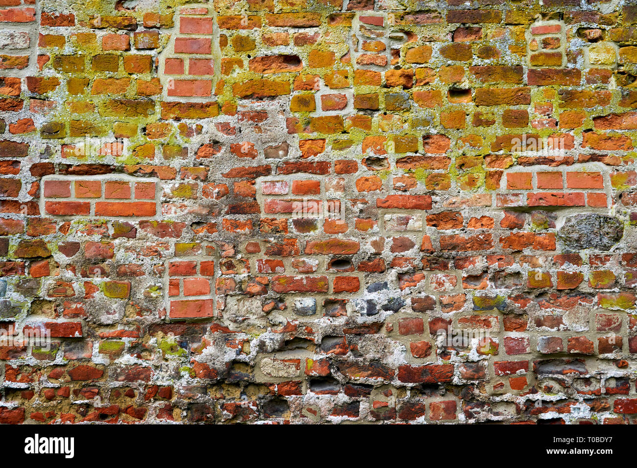 old repaired wall with brick texture Stock Photo - Alamy