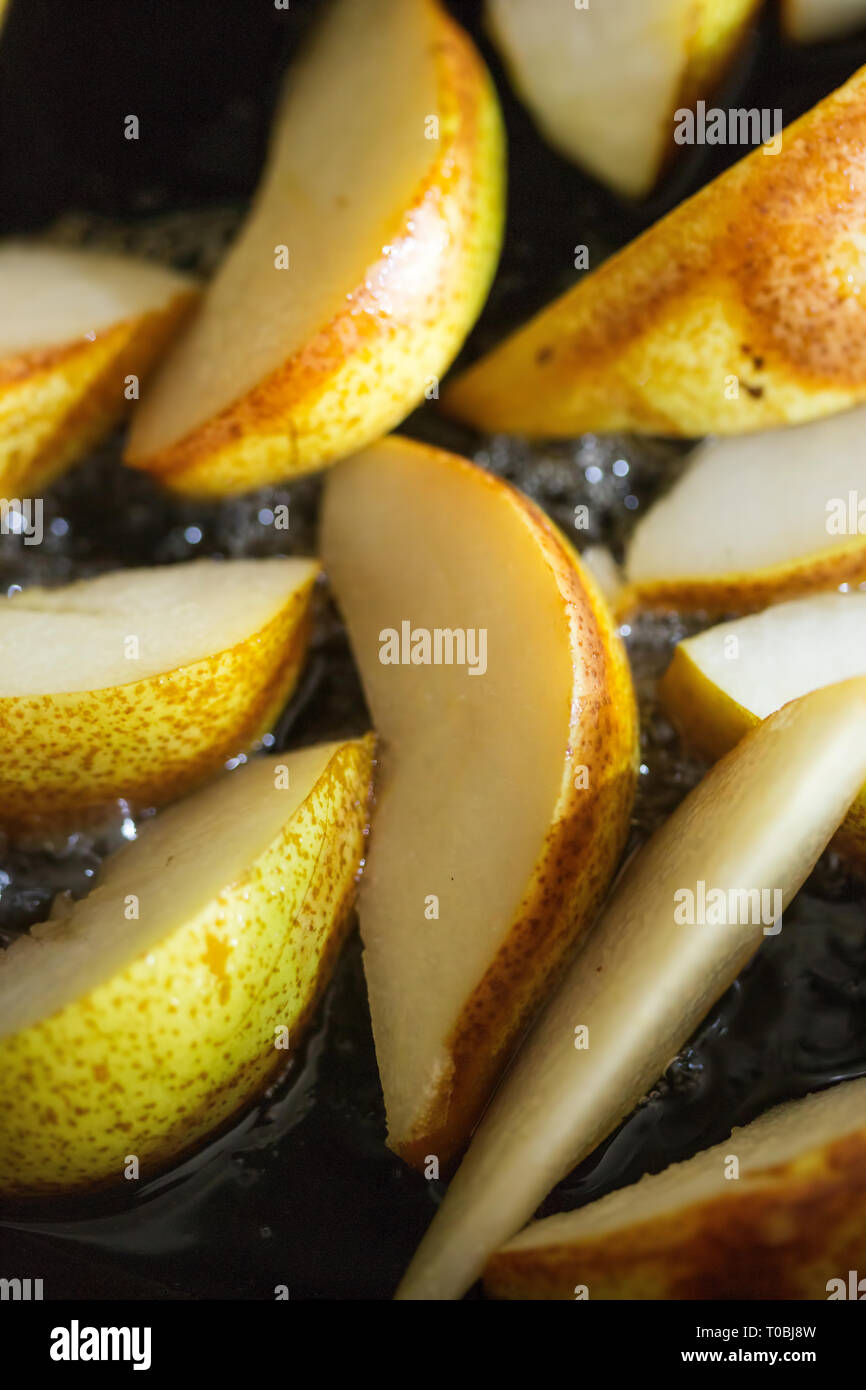 Fried pears on pan with honey Stock Photo - Alamy