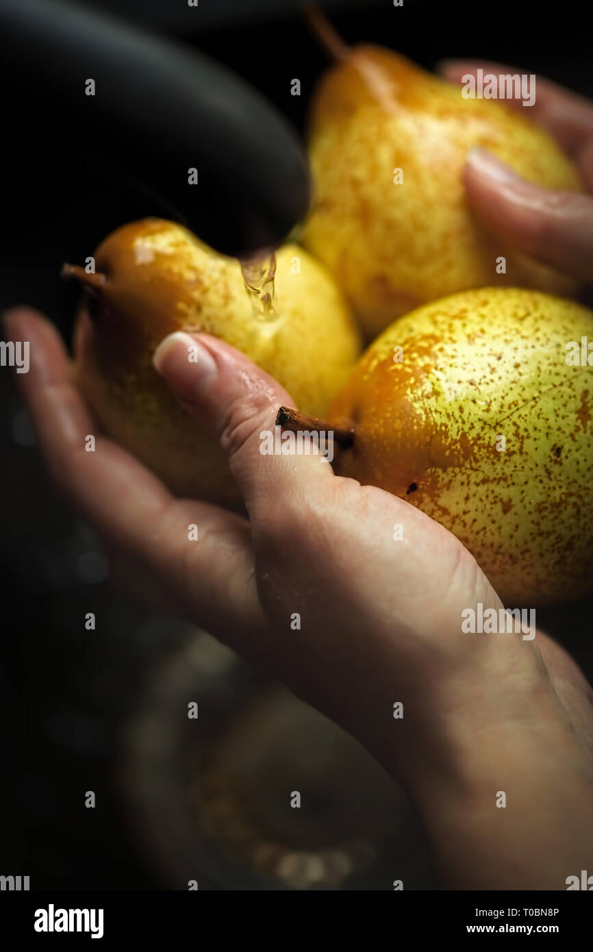 Hands holding pears hi-res stock photography and images - Alamy