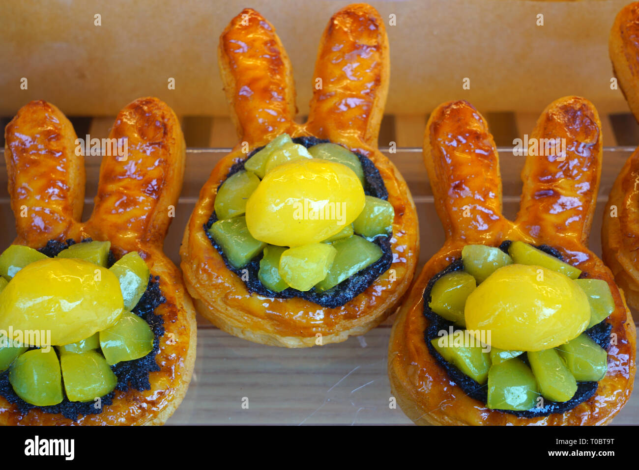 Bread pastries shaped as the Miffy bunny rabbit cartoon character in a ...