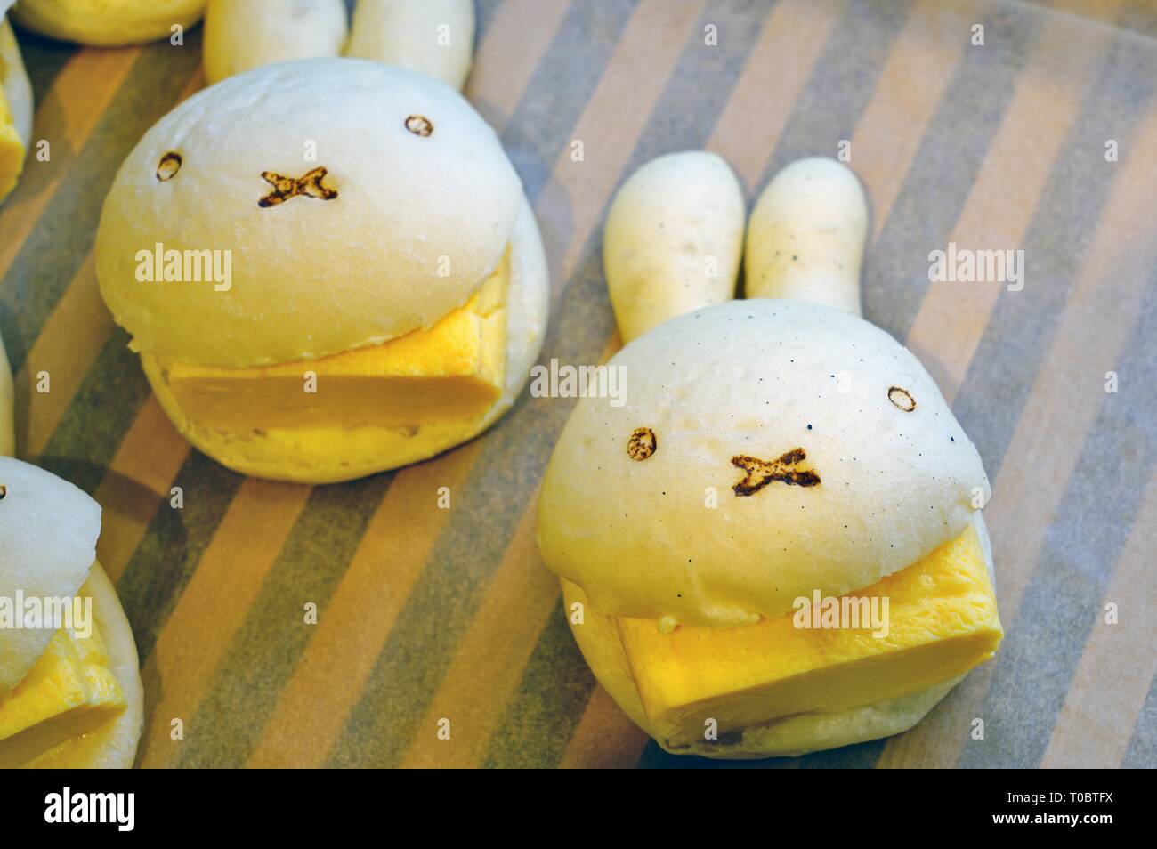 Bread pastries shaped as the Miffy bunny rabbit cartoon character in a ...