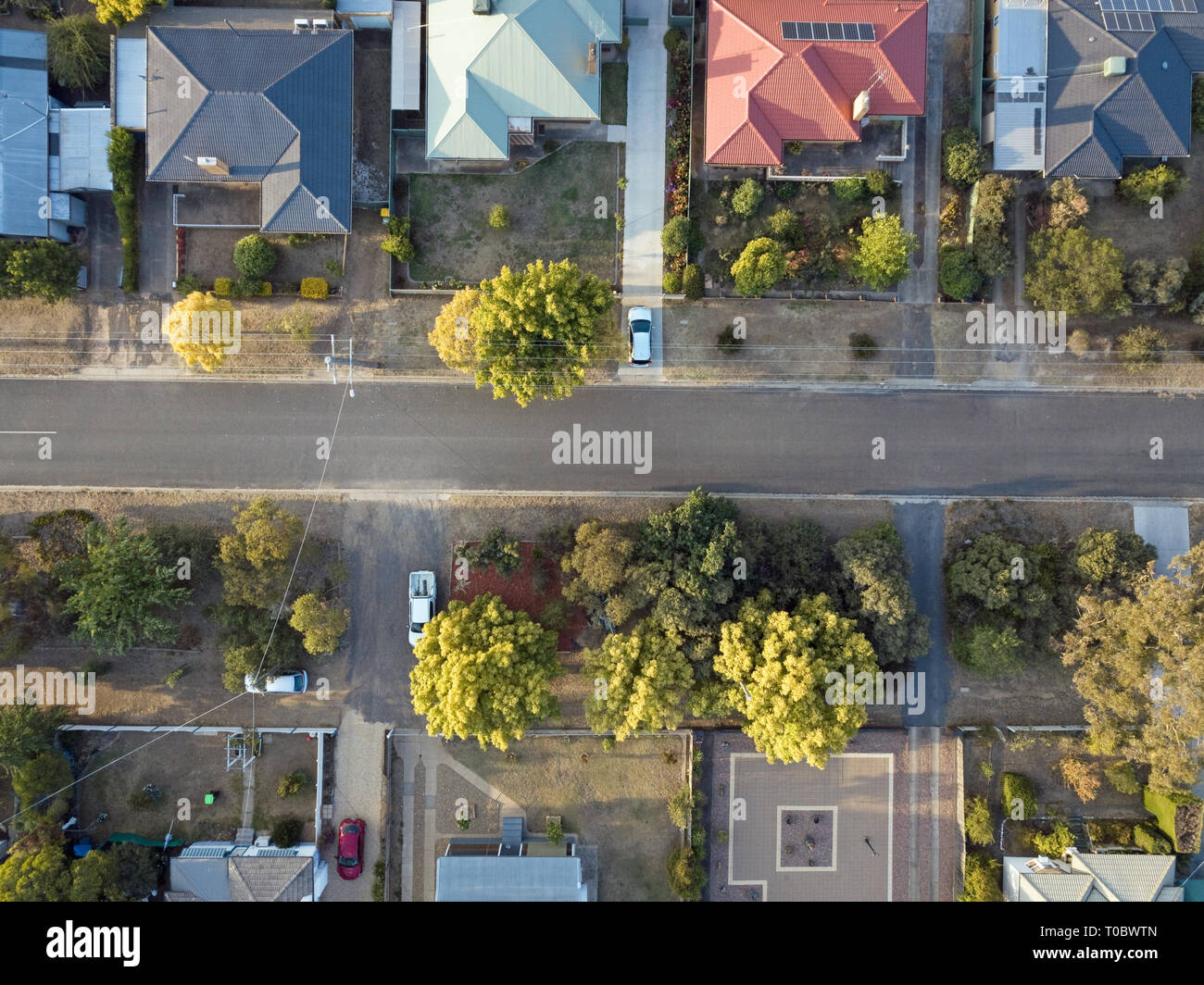 Aerial Australia urban street scene with houses, vehicles and yards ...