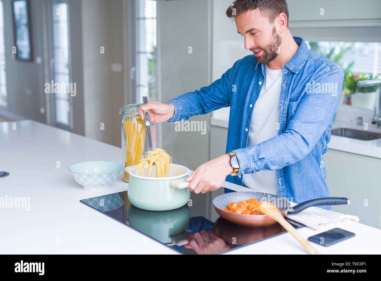 Taking raw pasta hi-res stock photography and images - Alamy