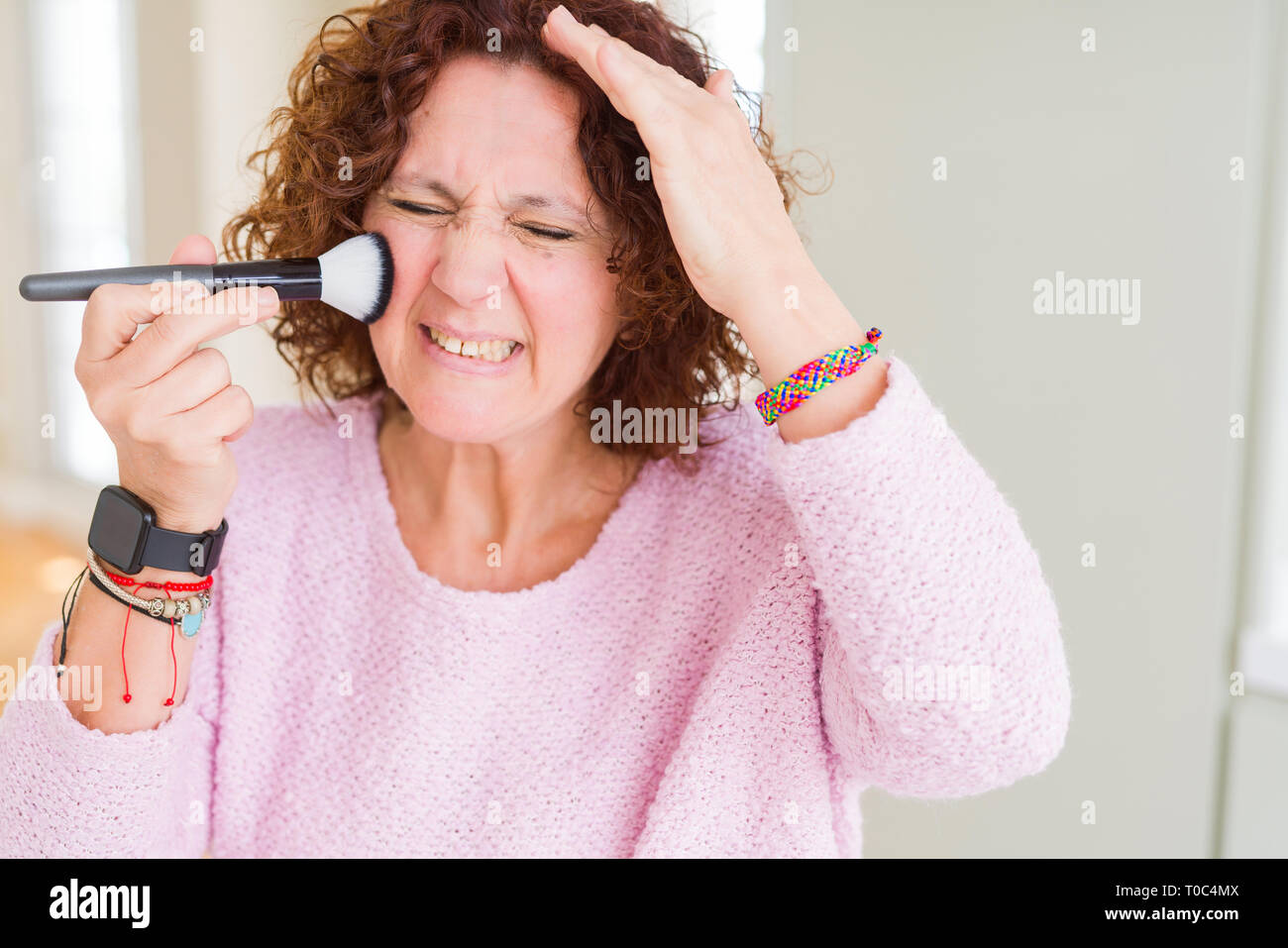 Applying makeup angry hi-res stock photography and images - Alamy