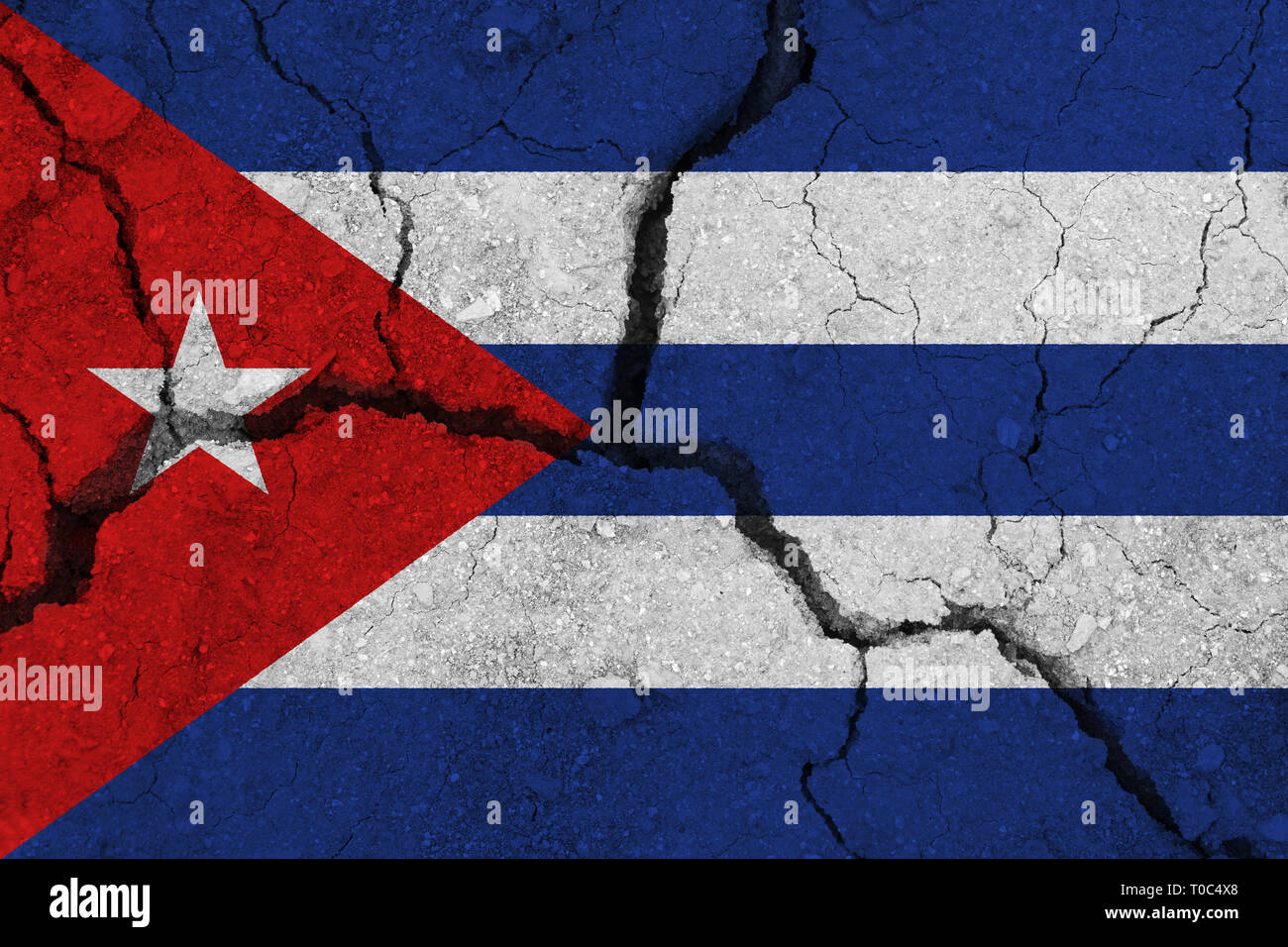 Cuba flag on the cracked earth. National flag of Cuba. Earthquake or ...