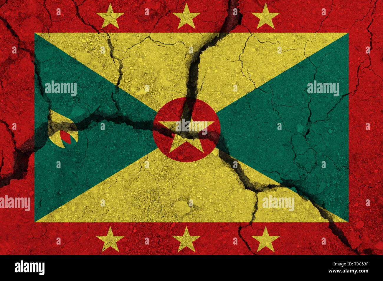 Grenada flag on the cracked earth. National flag of Grenada. Earthquake ...