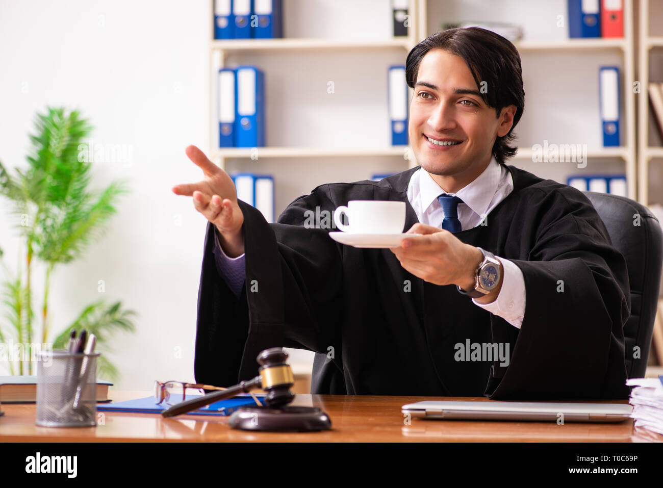 Young handsome judge working in court Stock Photo - Alamy