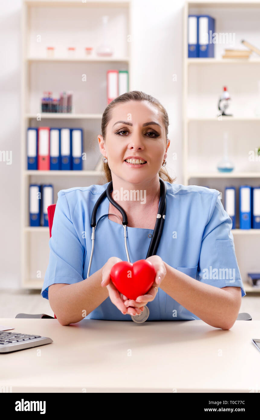 Female doctor cardiologist working in the clinic Stock Photo - Alamy