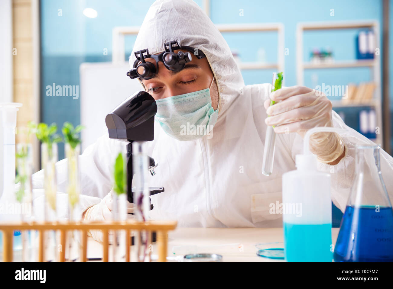 Male biotechnology scientist chemist working in the lab Stock Photo - Alamy