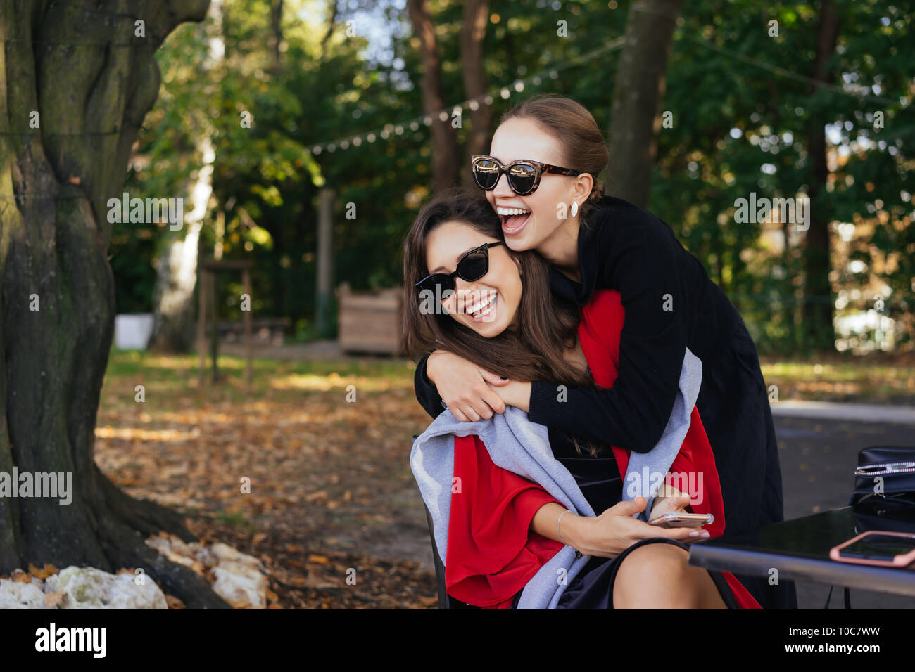 Girl hugging her friend. Portrait Two girlfriends in the park Stock ...