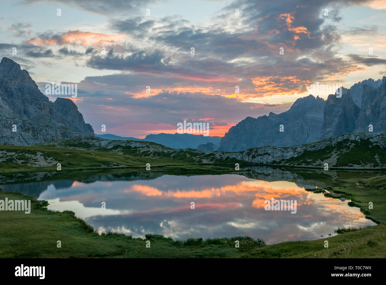 Beautiful reflections of mountains in alpine lake, Italy Stock Photo ...