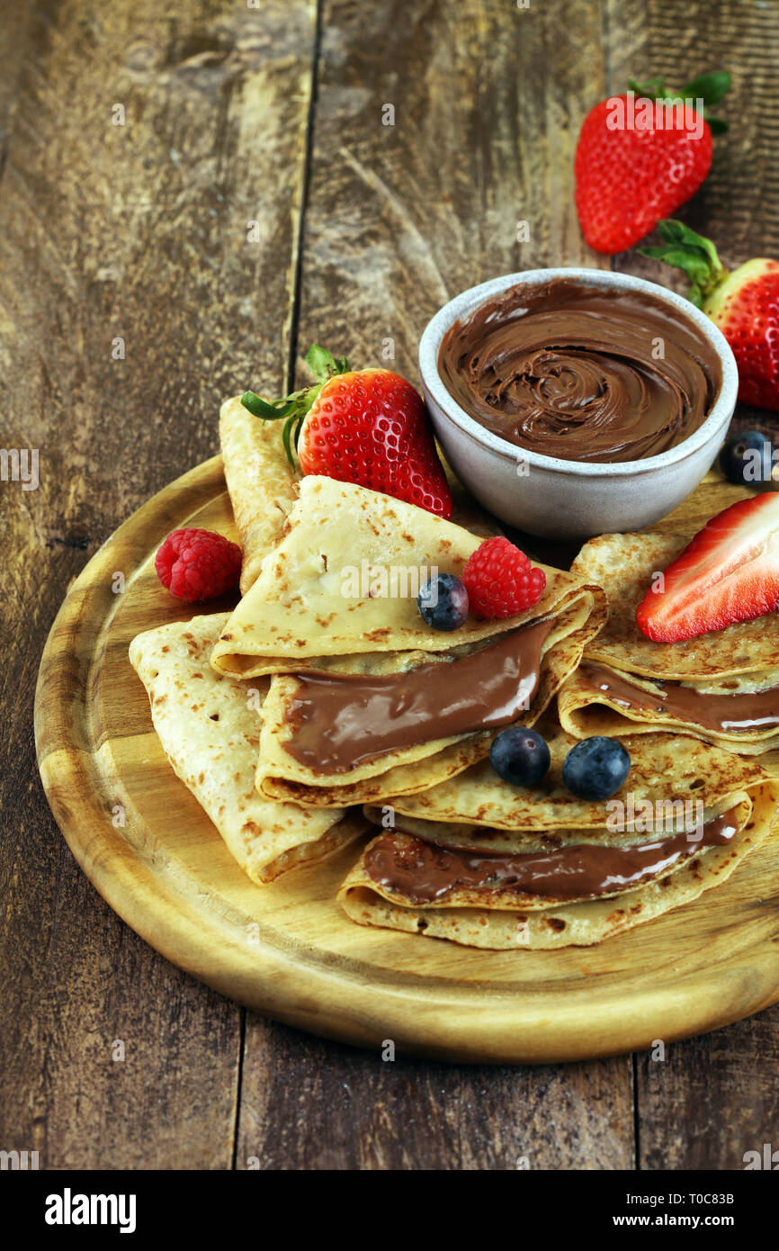 Delicious Tasty Homemade crepes with chocolate or pancakes with ...