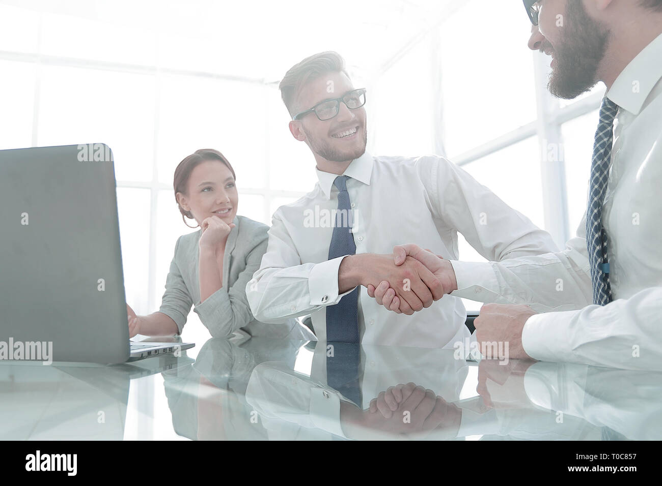 background image.handshakes colleagues at the Desk Stock Photo - Alamy