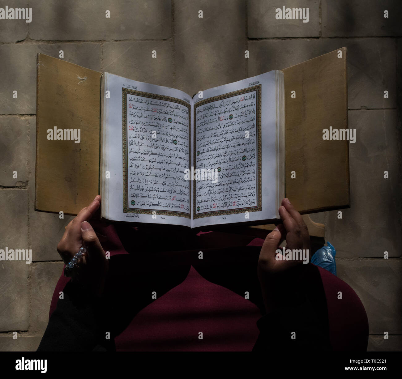 Reading quran in the mosque Stock Photo - Alamy