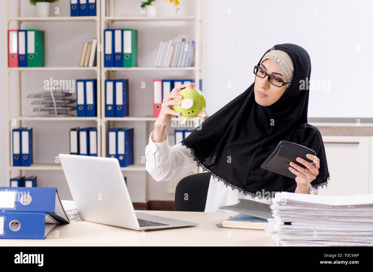 Female employee in hijab working in the office Stock Photo - Alamy