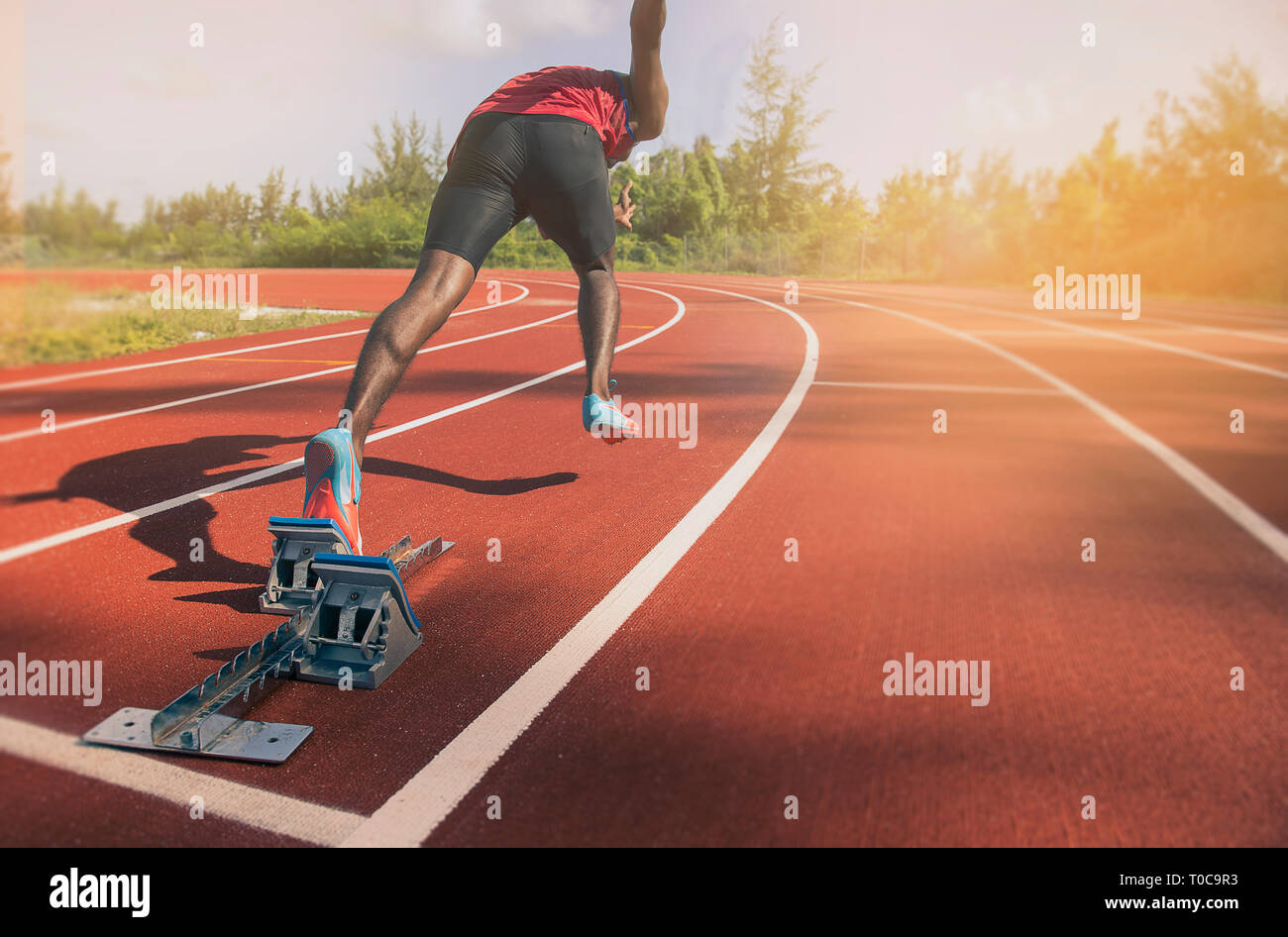 Athlete runner running on athletic track training his cardio. Jogger ...
